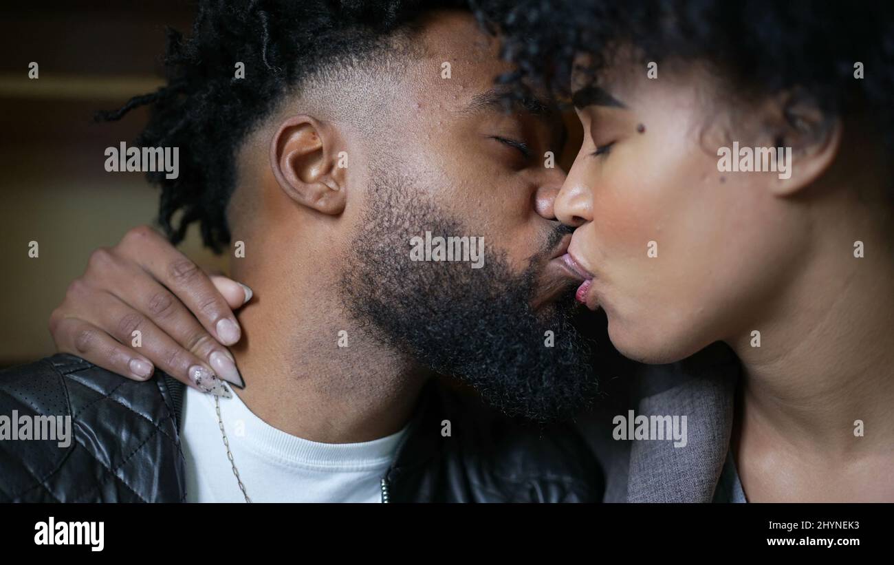 Passionate kiss a black couple kissing an African man and woman love Stock Photo - Alamy