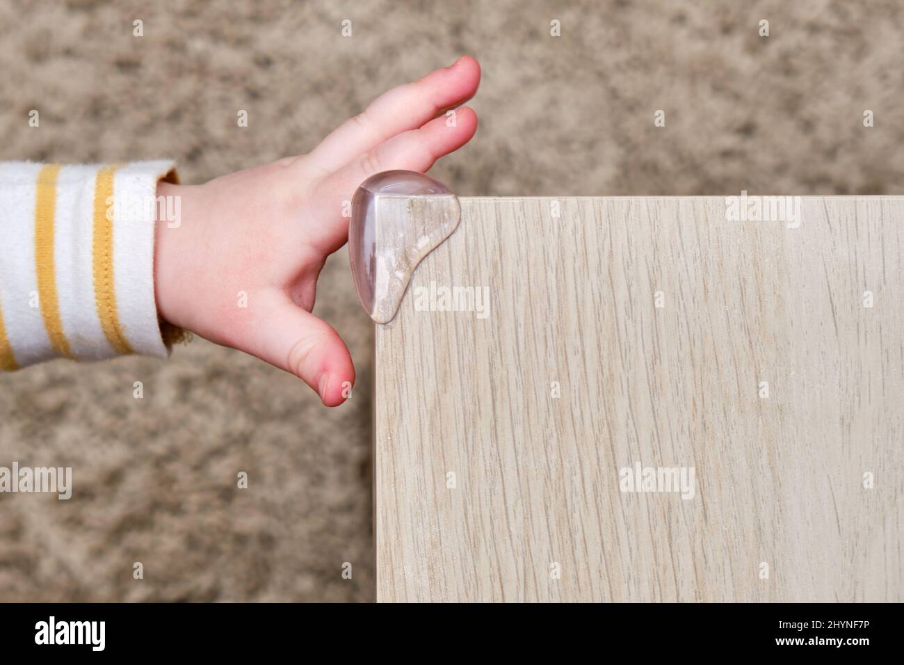 Danger for baby hit the corner of the table. Protect children from home ...