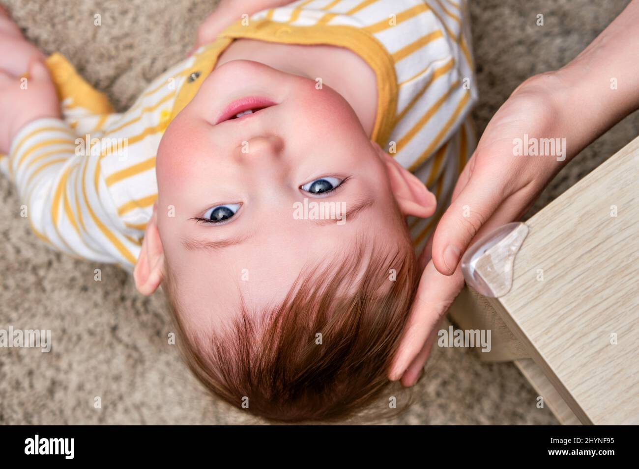 Danger for baby hit the corner of the table. Protect children from home ...