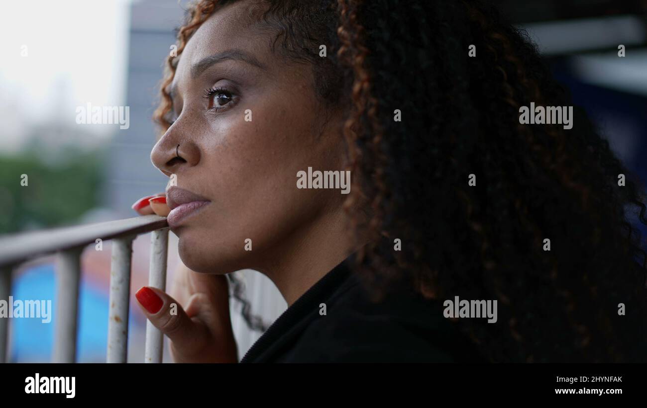 Woman peeking outside from balcony looking out staring out Stock Photo ...