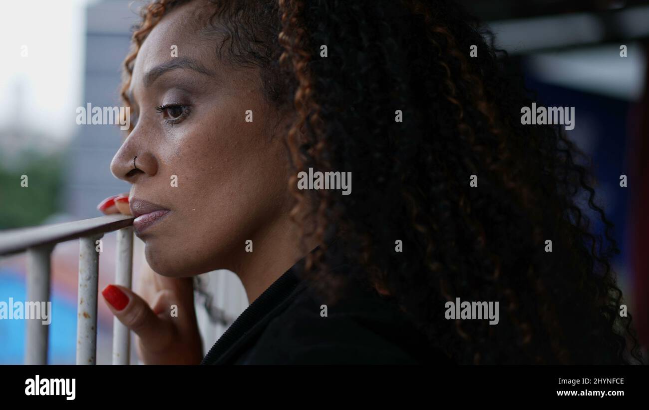 Woman peeking outside from balcony looking out staring out Stock Photo ...