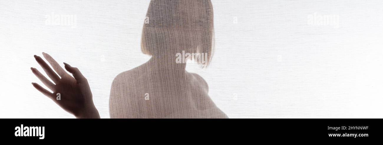 Young woman touching cloth on grey background, banner Stock Photo - Alamy