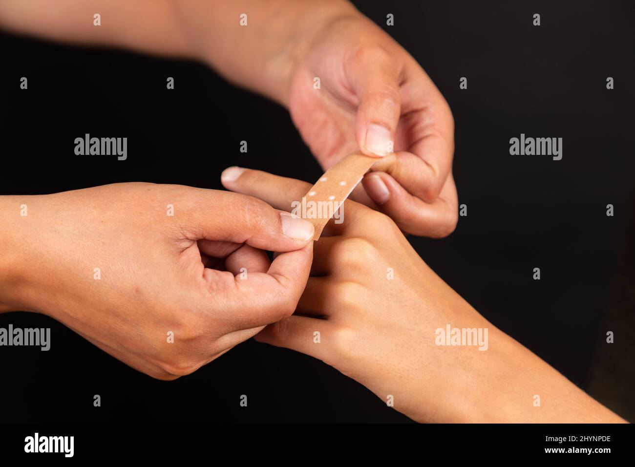 Hand putting medical adhesive hi-res stock photography and images - Alamy
