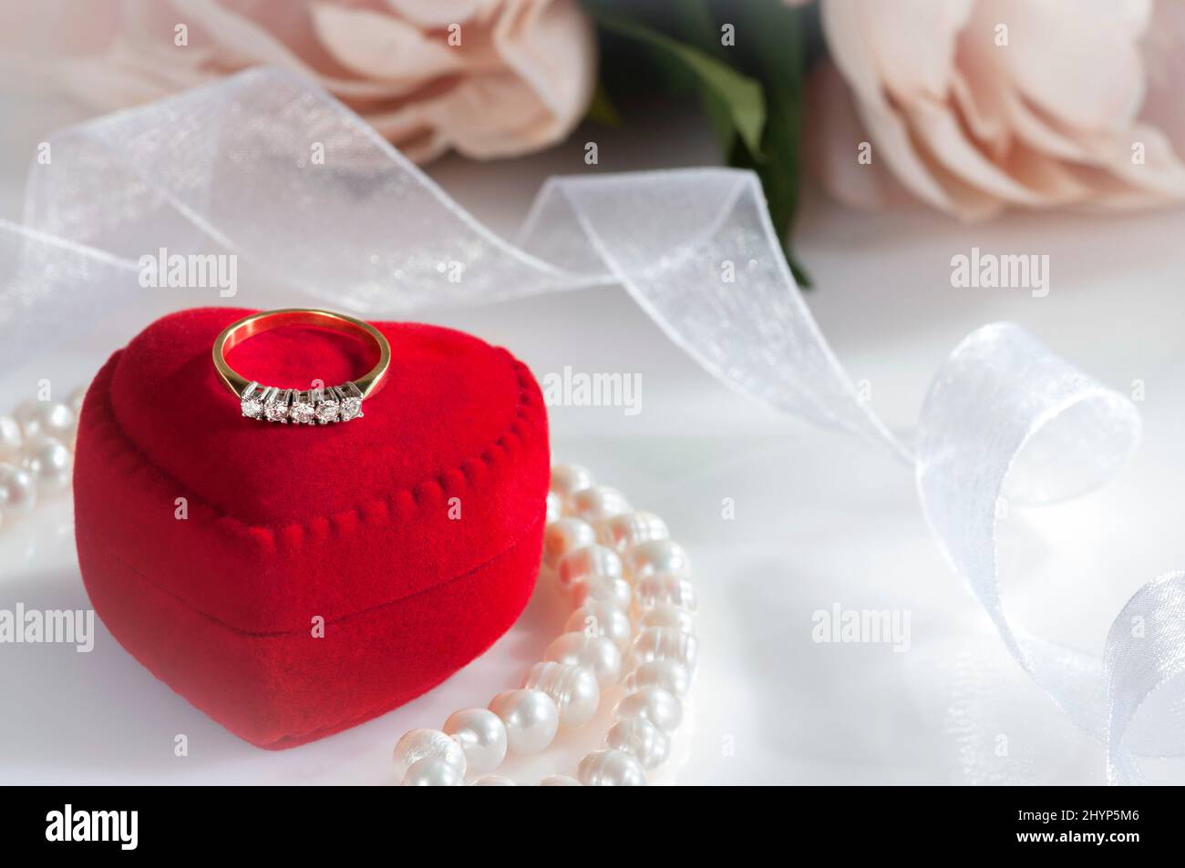 Diamond ring in a red box Stock Photo - Alamy