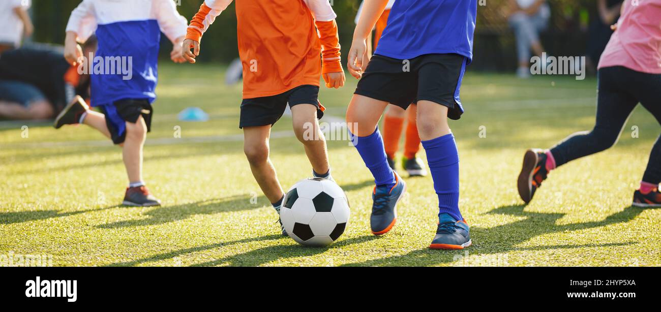Running Soccer Football Players During the Sunrise. Footballers Kicking ...