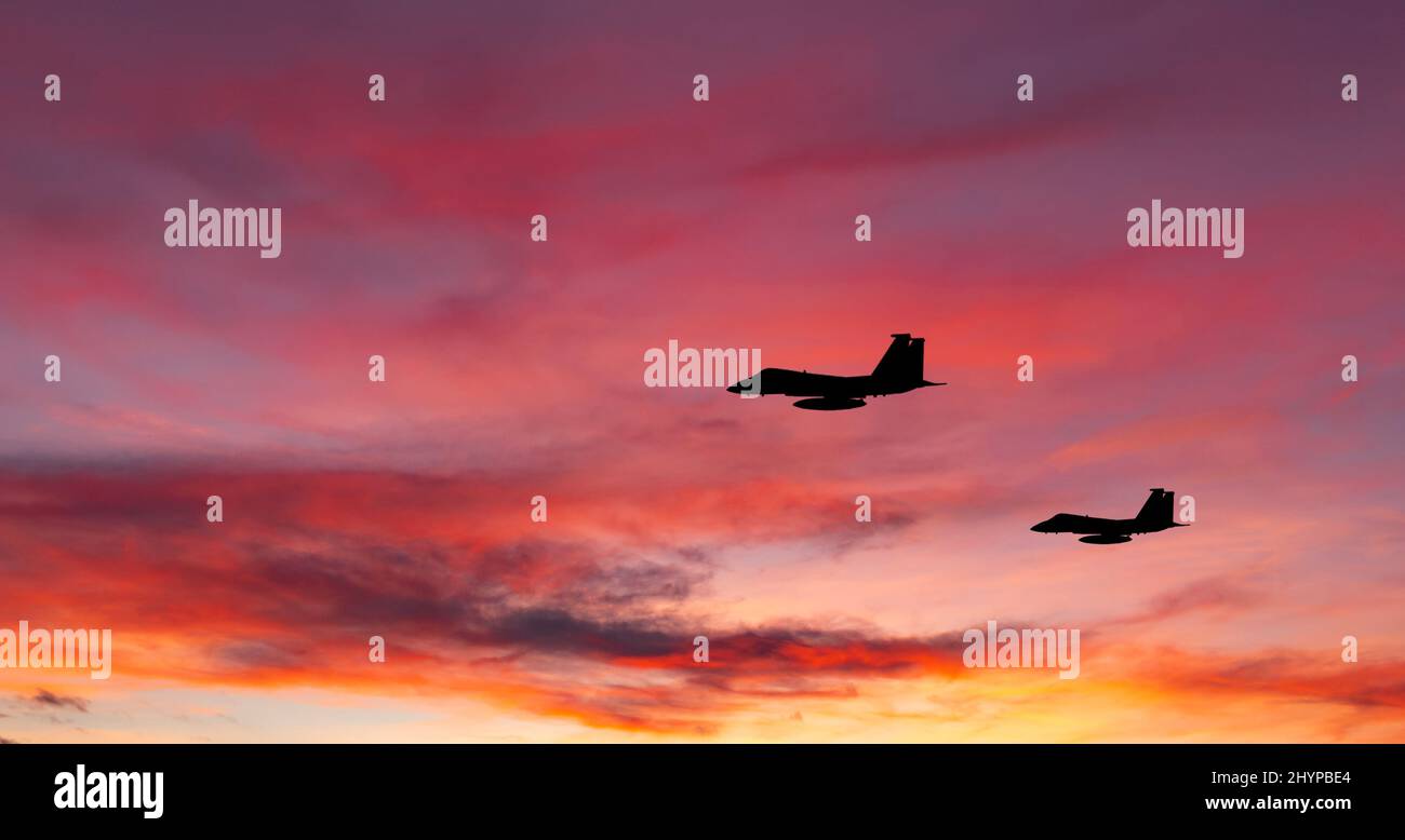 War aircrafts at sunset sky Stock Photo - Alamy