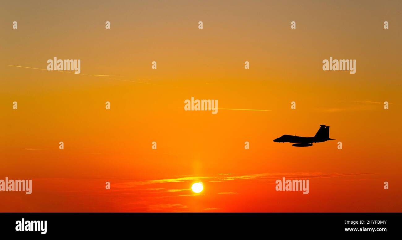 War aircrafts at sunset sky Stock Photo - Alamy
