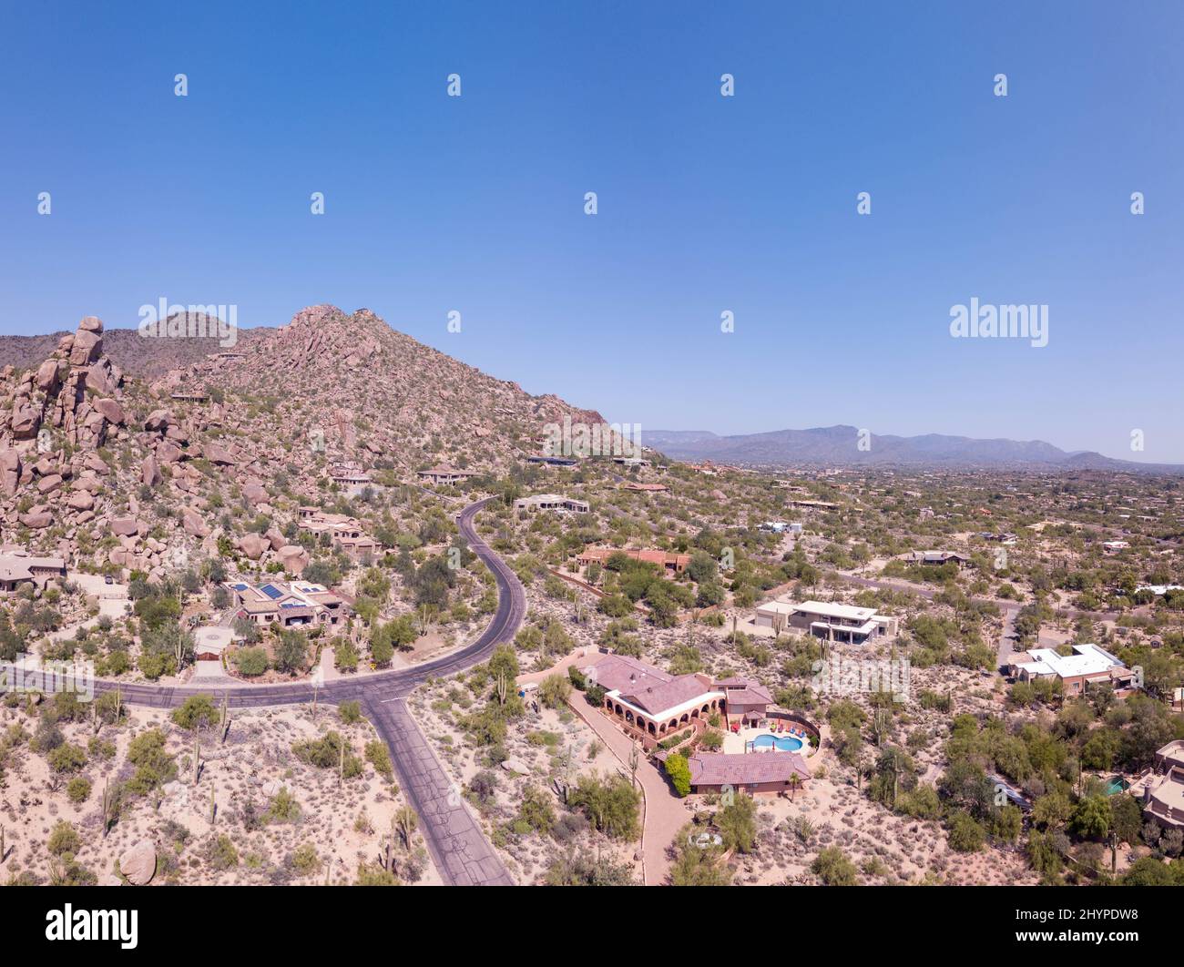 Beautiful desert covered with plants under he clear sky on a shot sunny ...