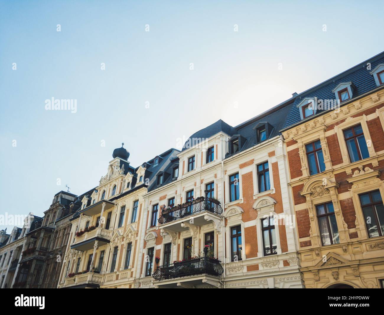Beautiful low angle shot of the facade of old colorful brick buildings ...