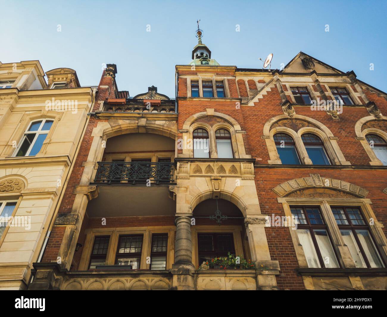Low angle shot of the facade of an old orange brick stone building in ...