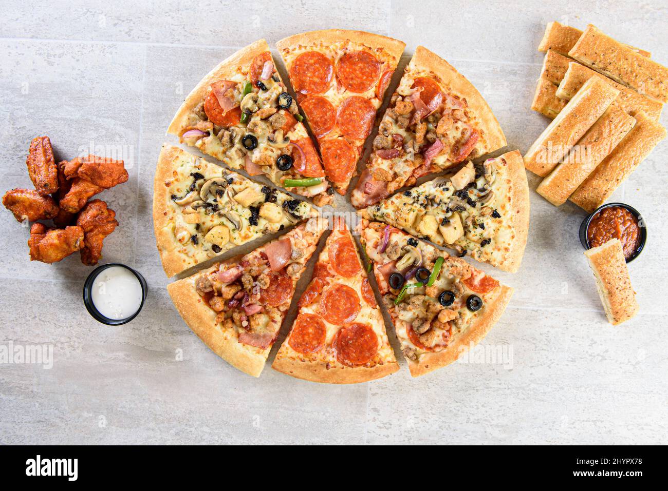 Multiple pizza flavors in one pie Stock Photo - Alamy