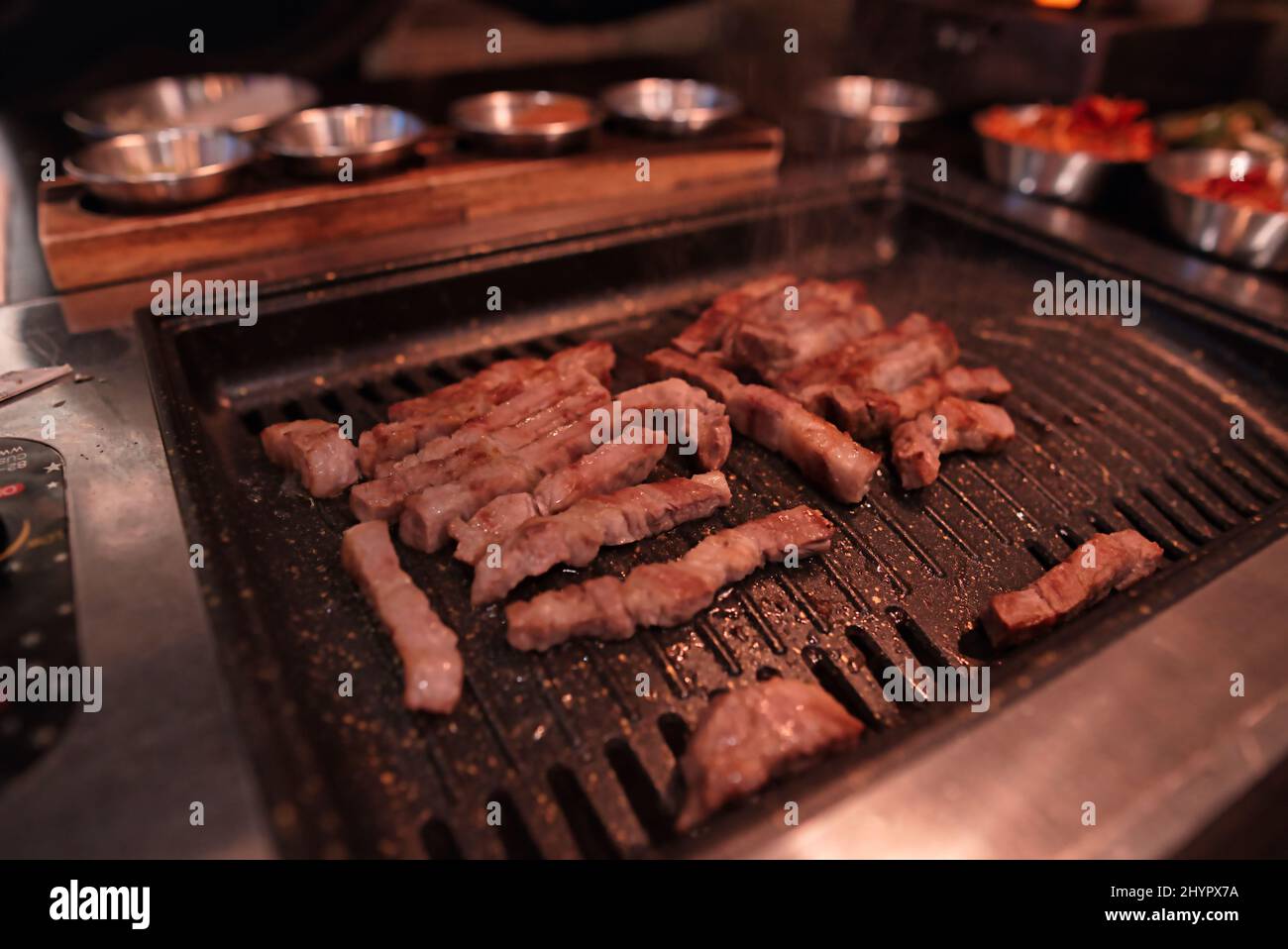 Grilled meat in a Korean restaurant Stock Photo - Alamy