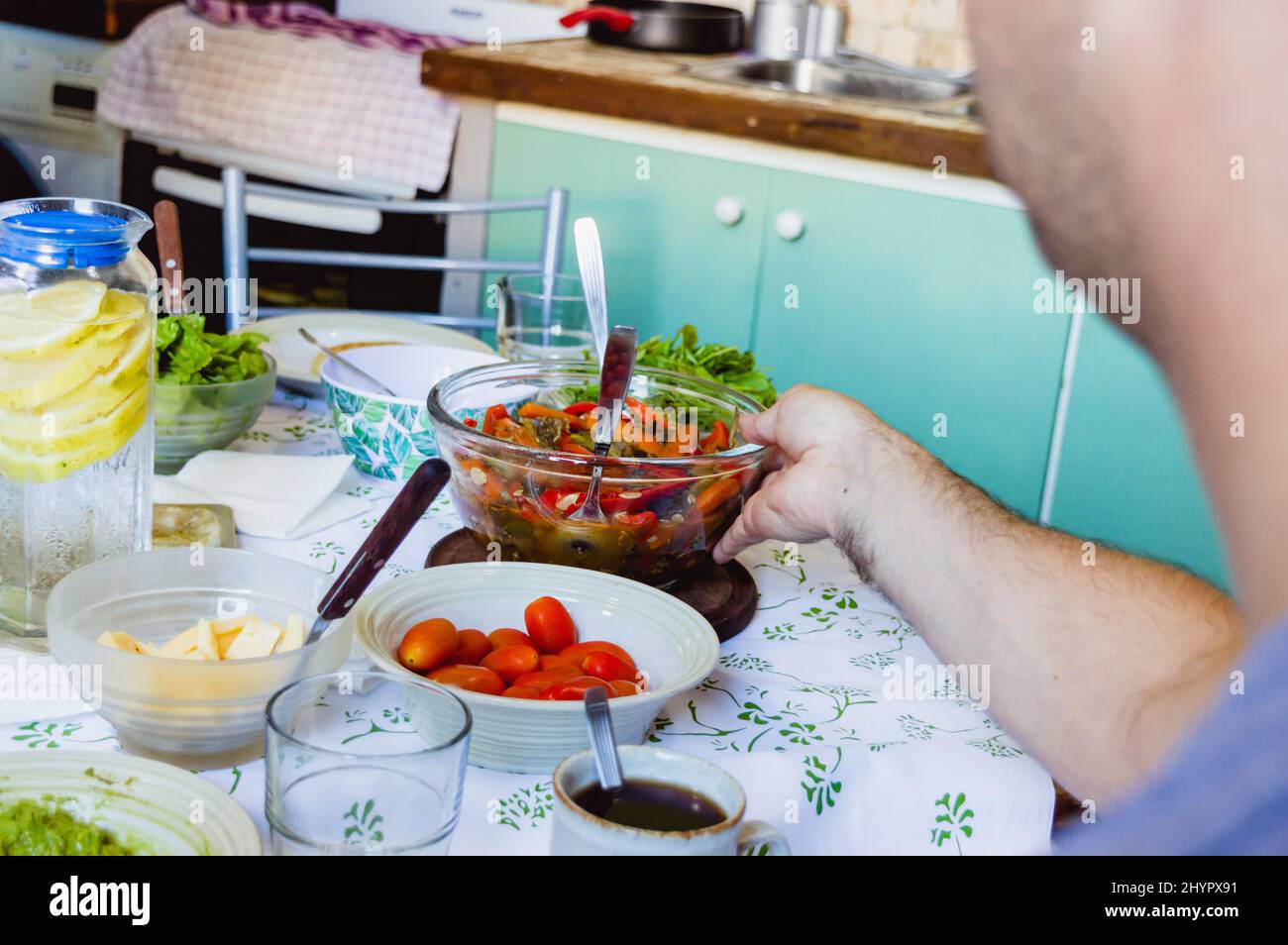 Taking cherry tomatoes from bowl hi-res stock photography and images ...