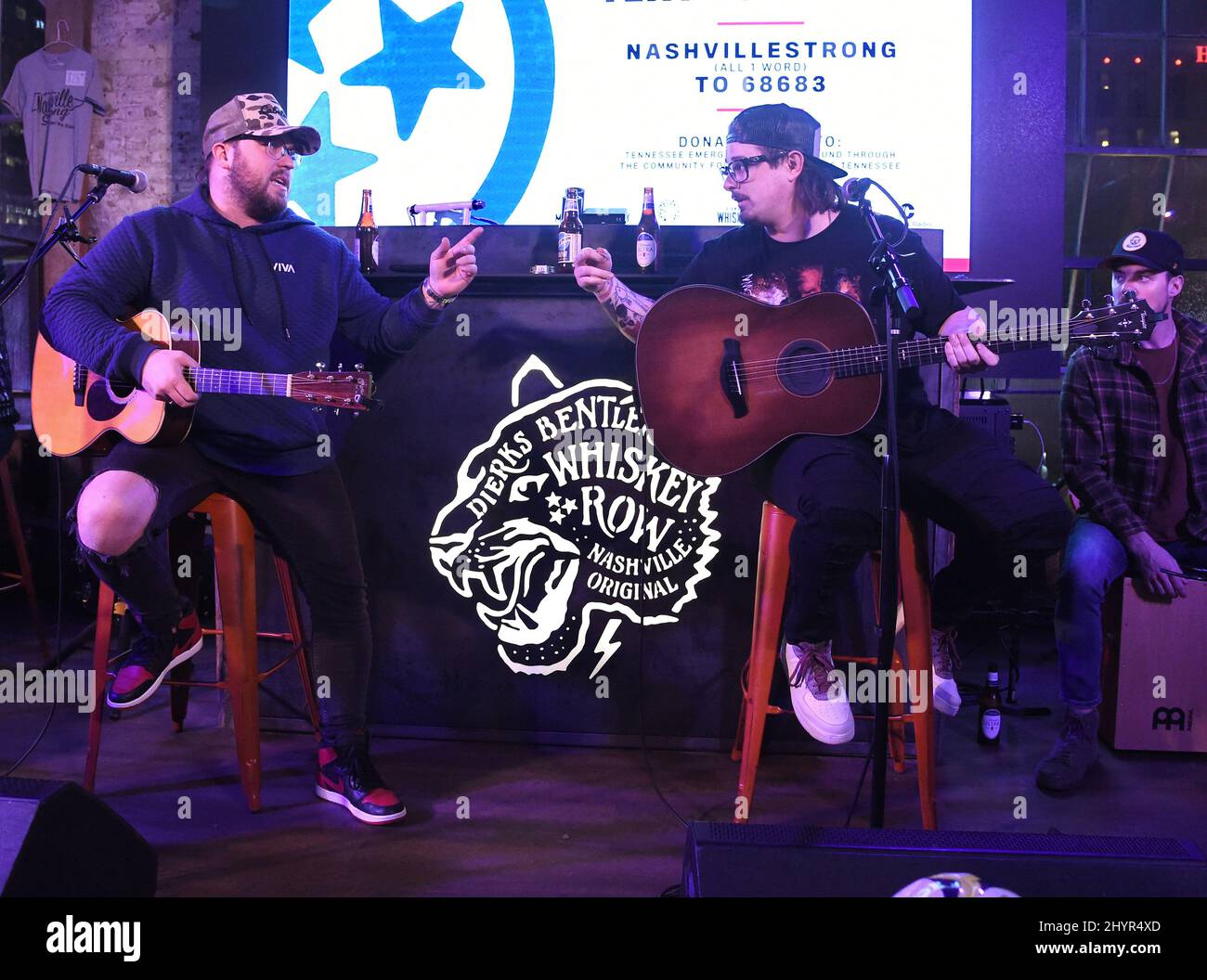 Mitchell Tenpenny and Hardy on stage at the Whiskey Row Tornado Relief ...