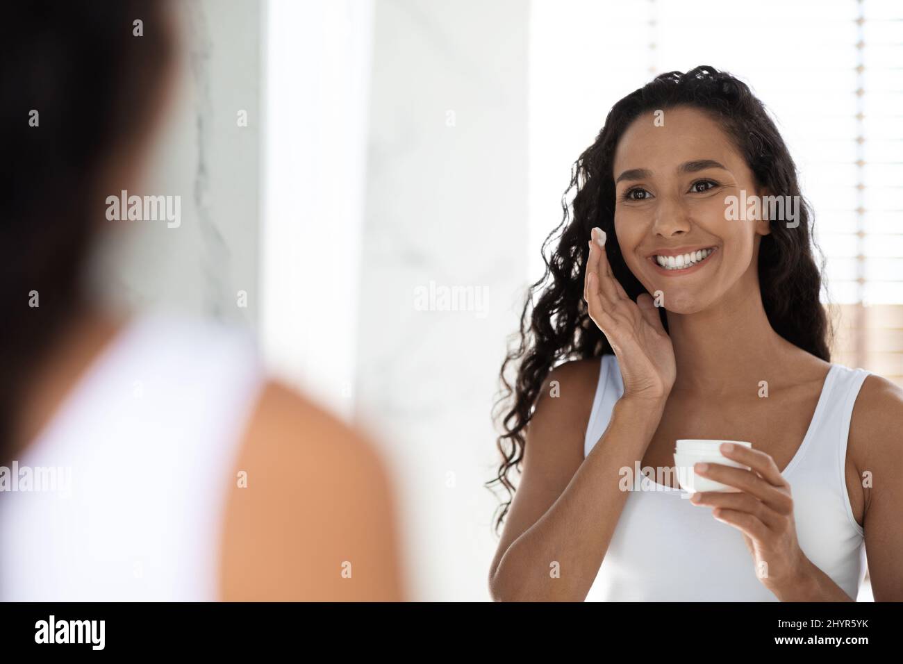 Skin Pampering. Attractive Millennial Lady Applying Nourishing Cream On ...