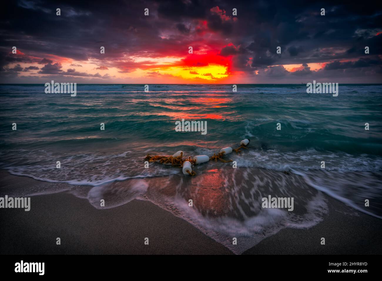 Photo of yellow ropes thrown out of the ocean on a long exposure Stock ...