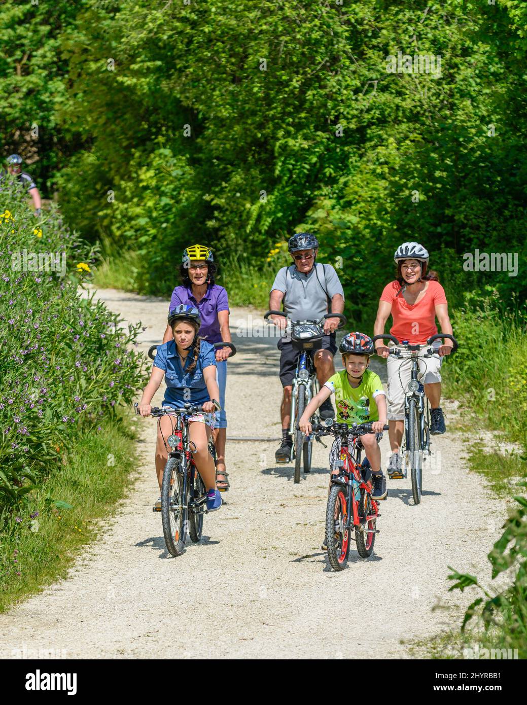 Mother with kids doing a cycling tour in beautiful nature in southern ...