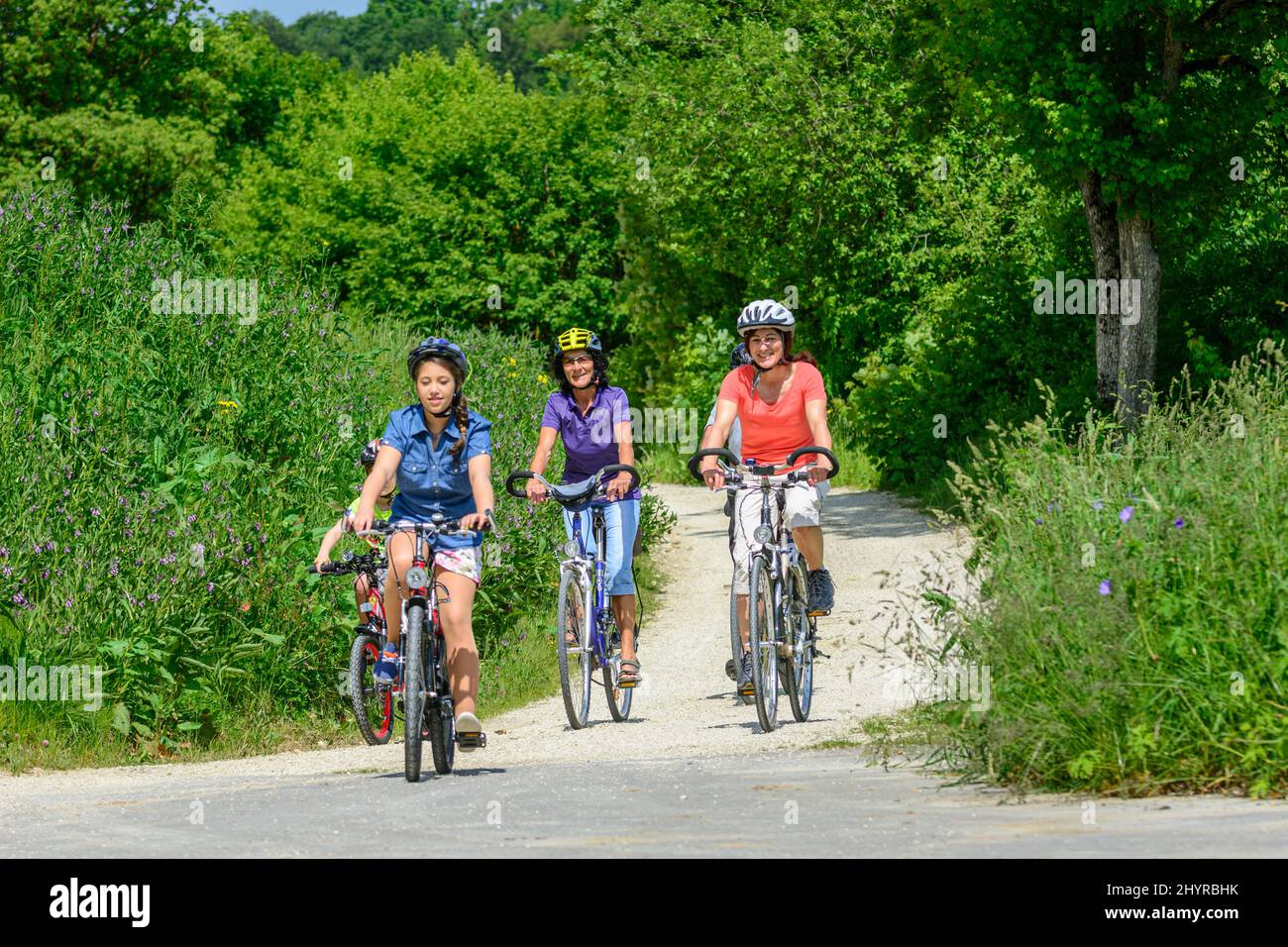 Mother with kids doing a cycling tour in beautiful nature in southern ...