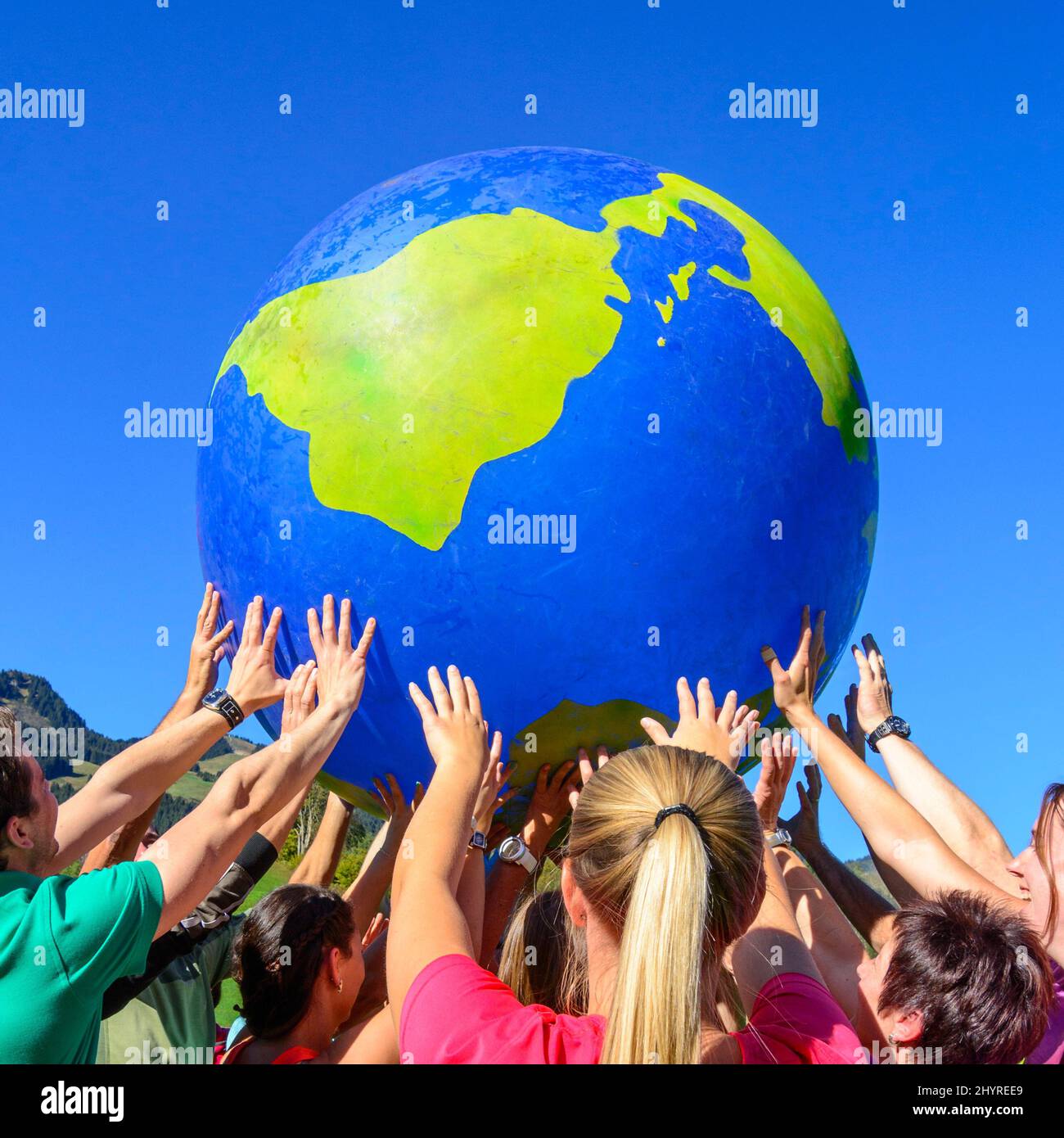 Let us carry the world on our hands Stock Photo - Alamy