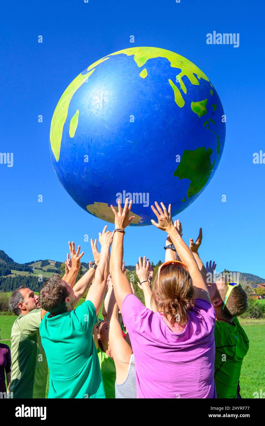 Let us carry the world on our hands Stock Photo - Alamy