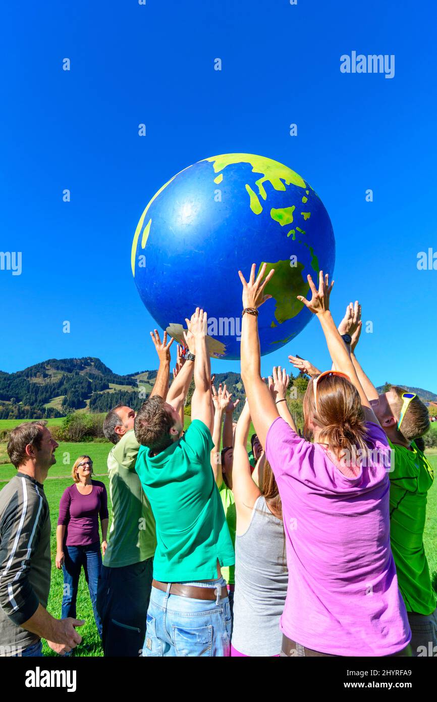 Let us carry the world on our hands Stock Photo - Alamy