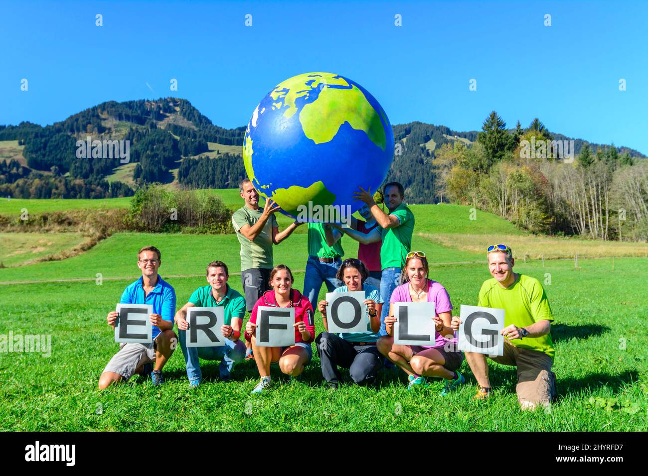 Successful only together - let us carry the world on our hands Stock ...