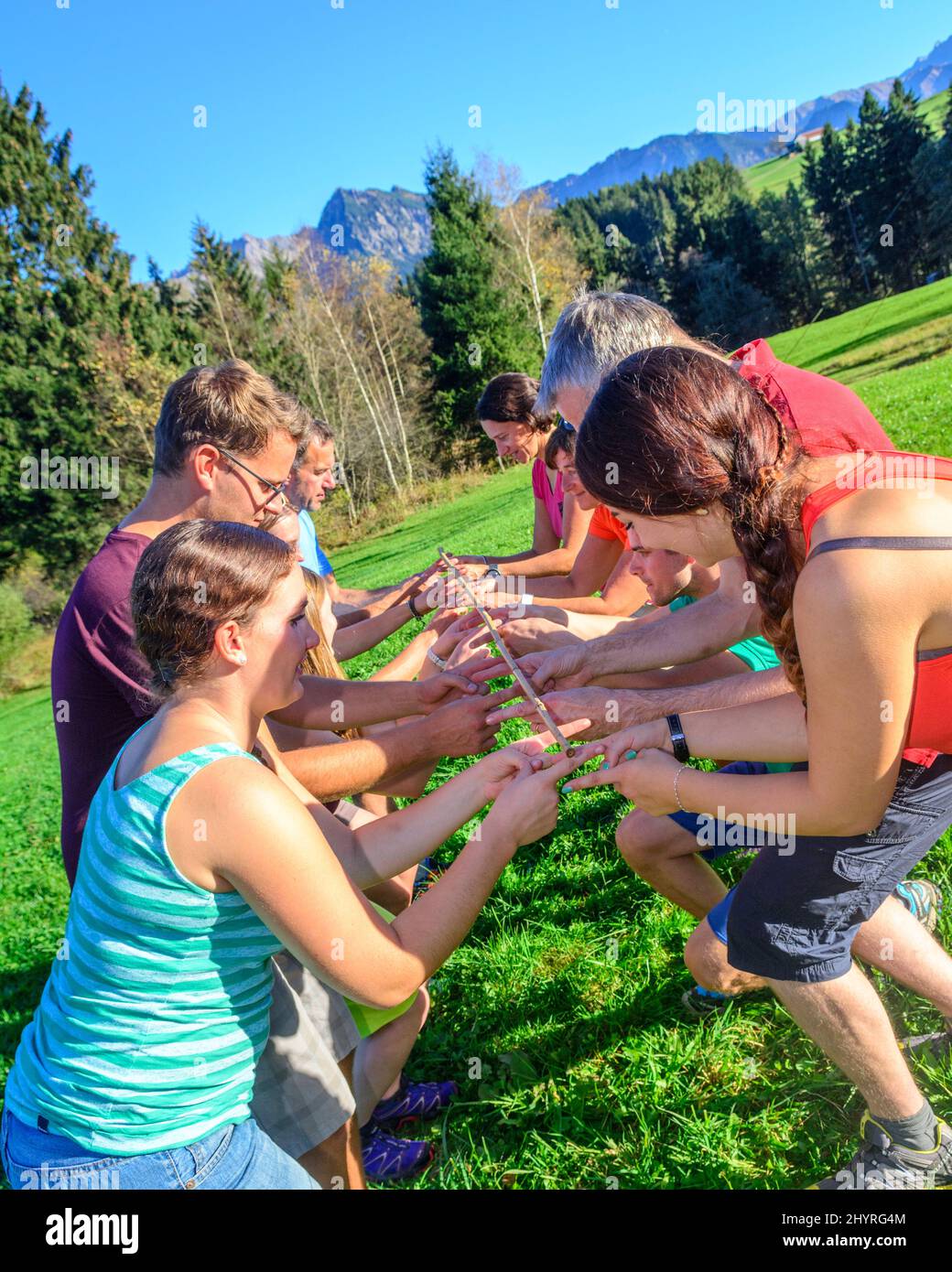 A group during a team-building exercise - teamwork ultimately brings ...