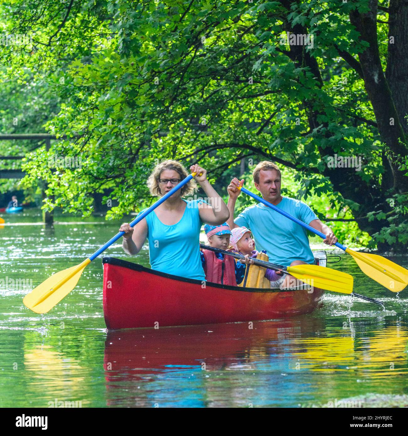 Good-humoured family in canoe on Pegnitz river in bavaria Stock Photo ...