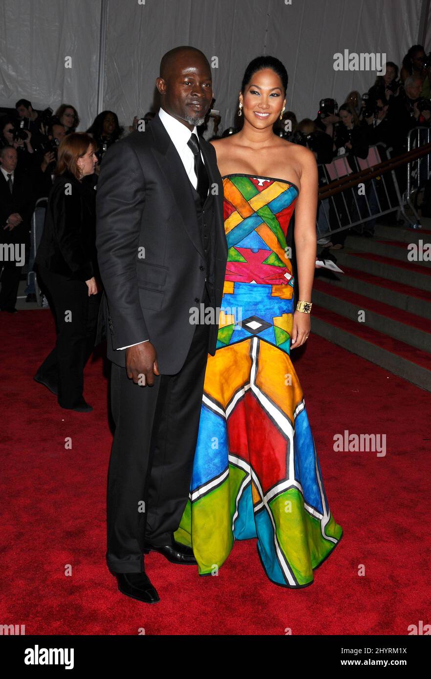Djimon Hounsou and Kimora lee Simmons arriving at the Costume Institute ...