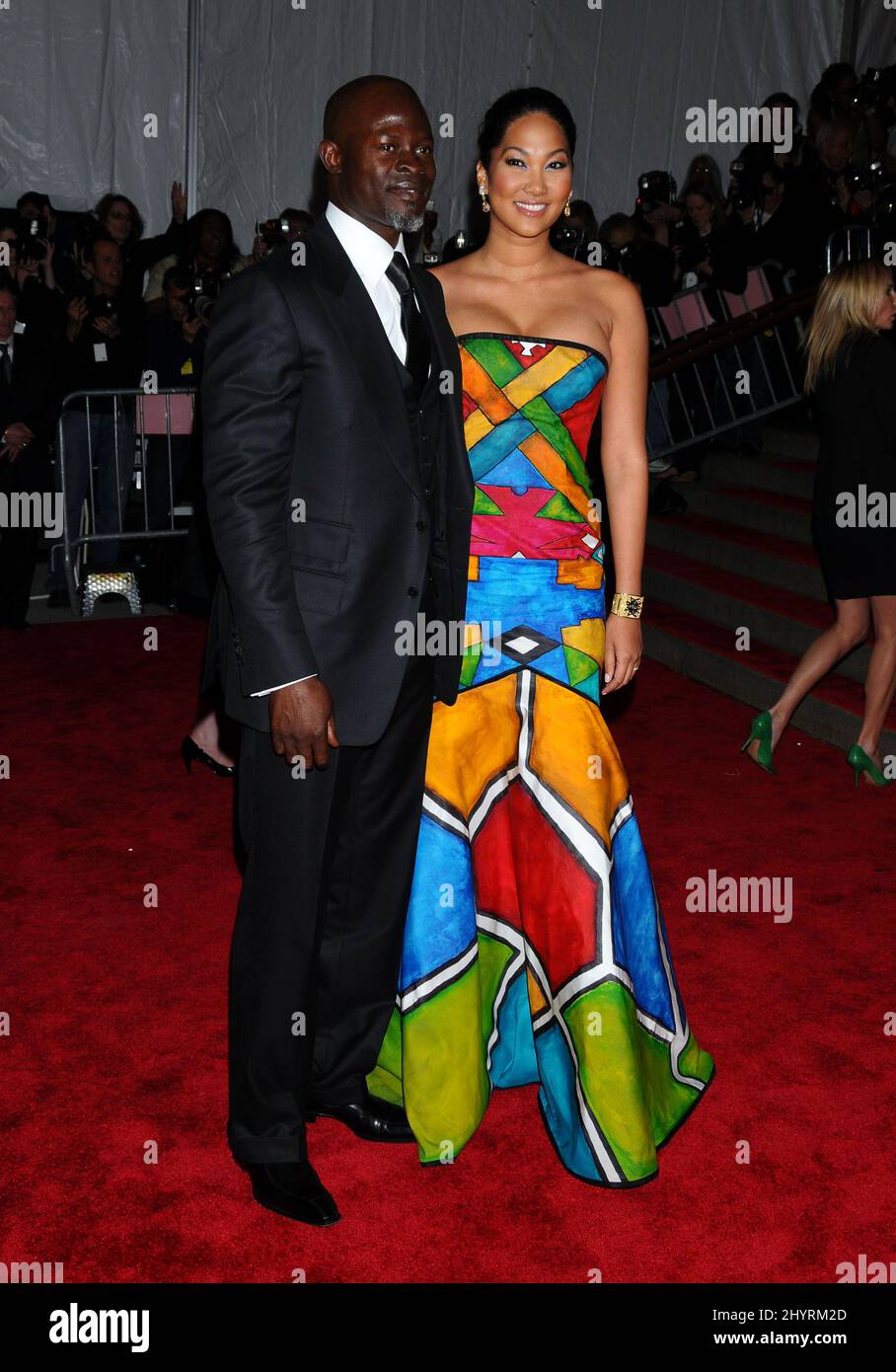 Djimon Hounsou and Kimora lee Simmons arriving at the Costume Institute ...