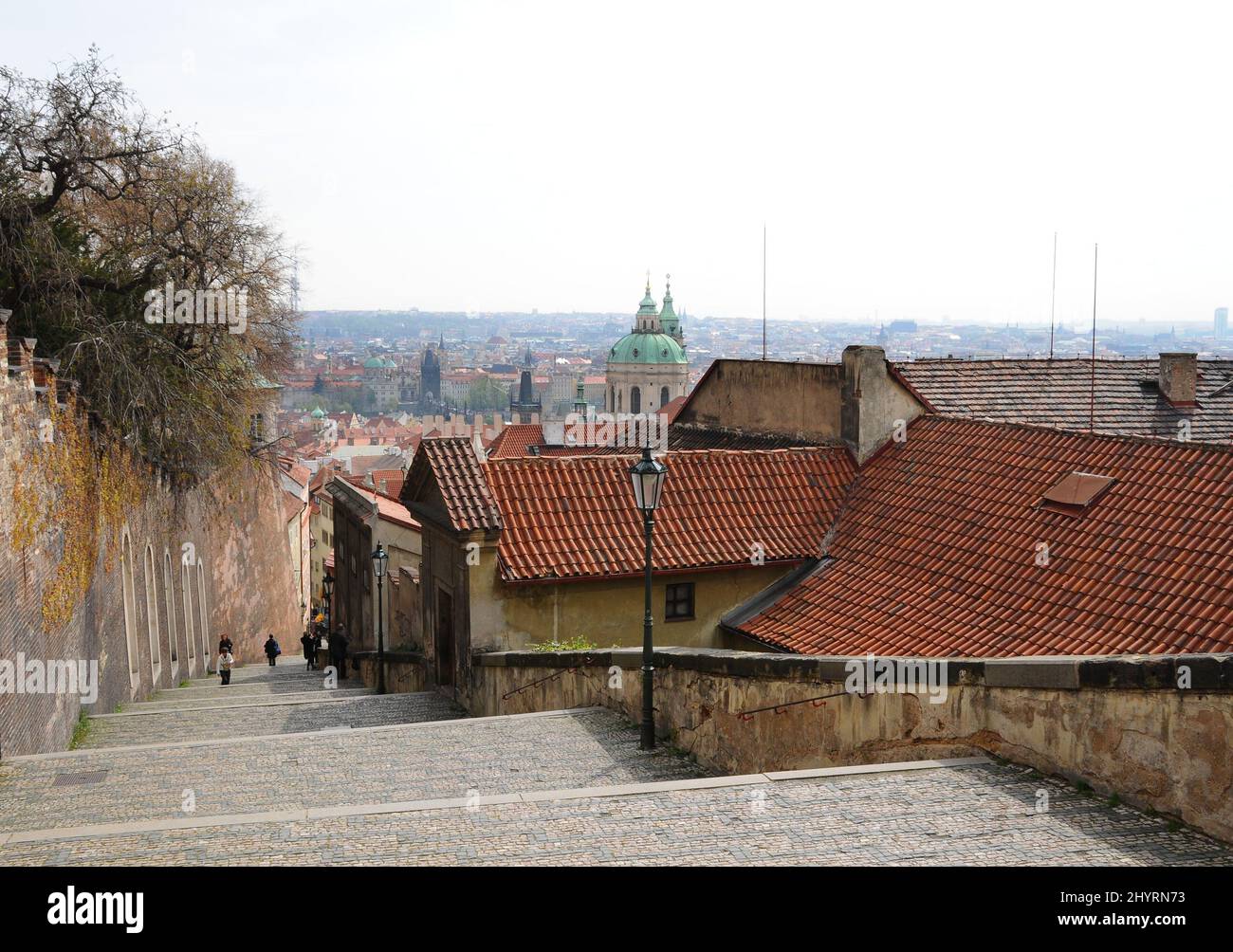 Cobblestone stairs down from the castle with a view of Prague, Czech ...
