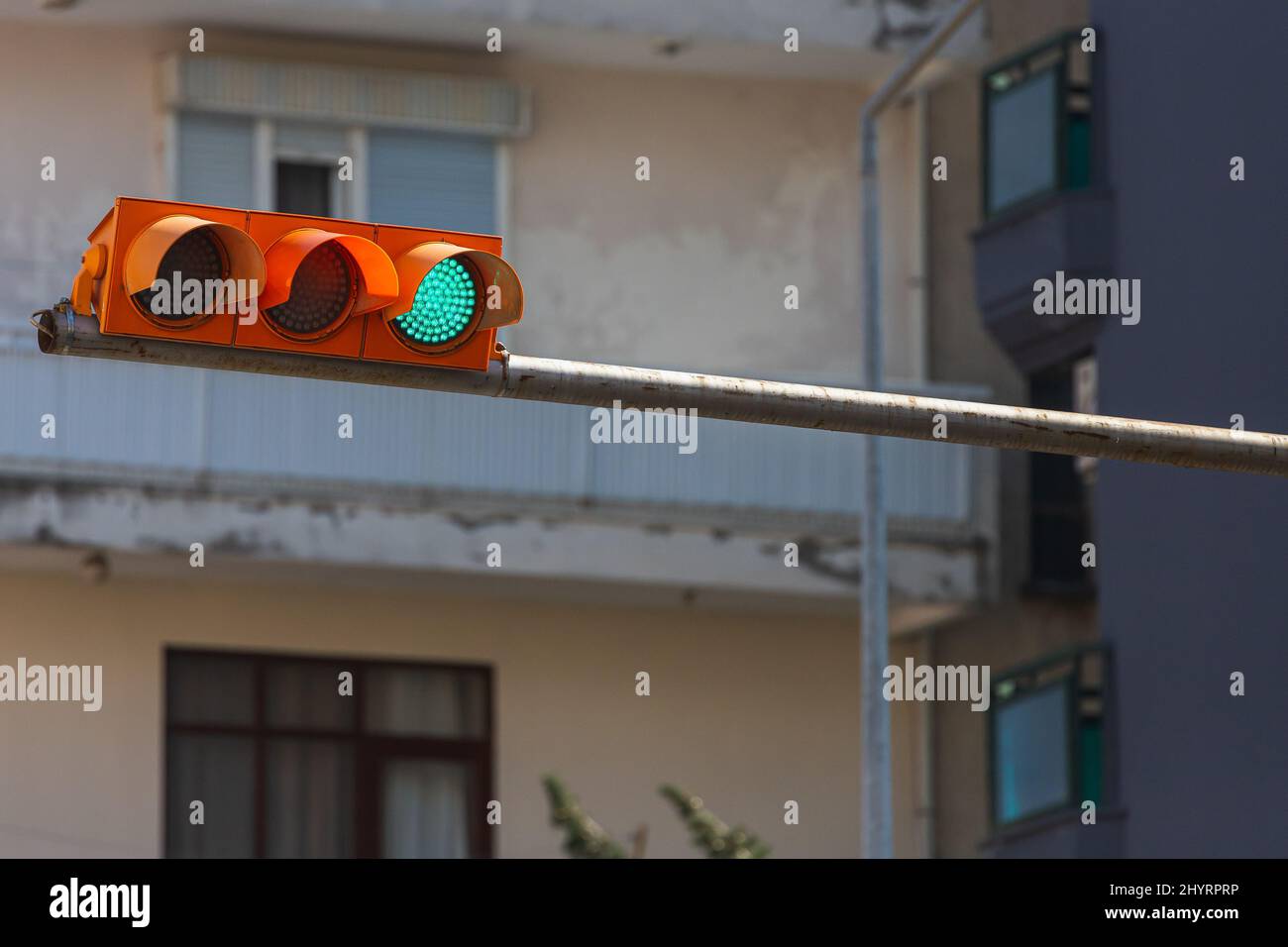 Traffic lights over urban intersection. Green light Stock Photo - Alamy