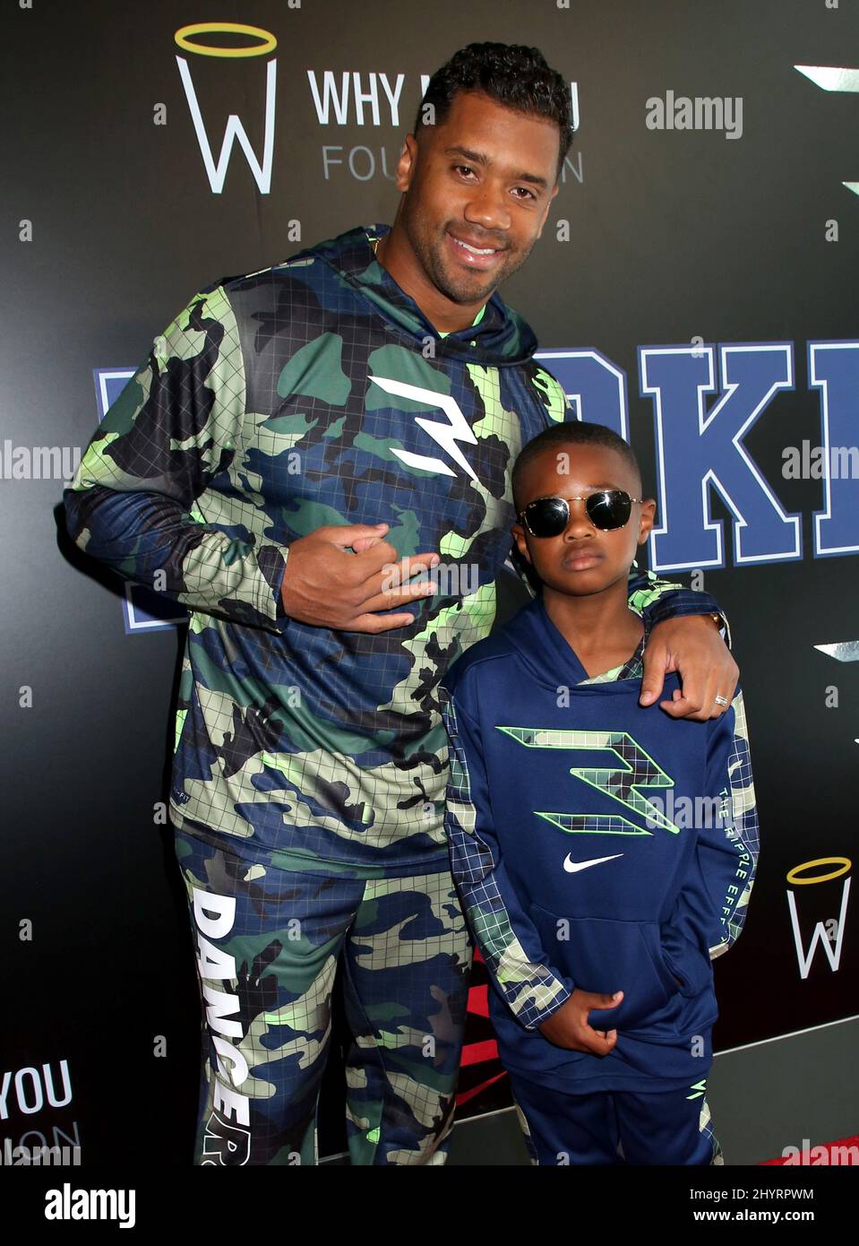 Russell Wilson & son Future Zahir Wilburn attending Russell Wilson ...