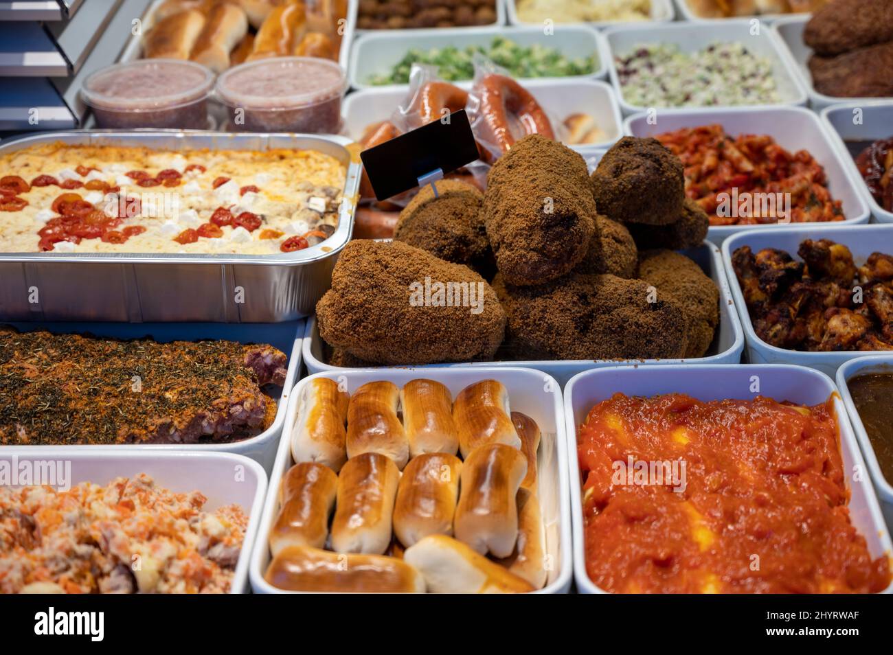 Assortment of gourmet meat dishes in butchery delicatessen shop, food ...