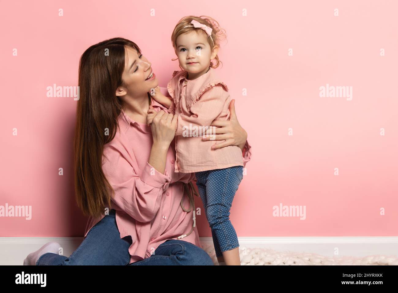 Support and care. Young woman and little girl, mother and daughter ...