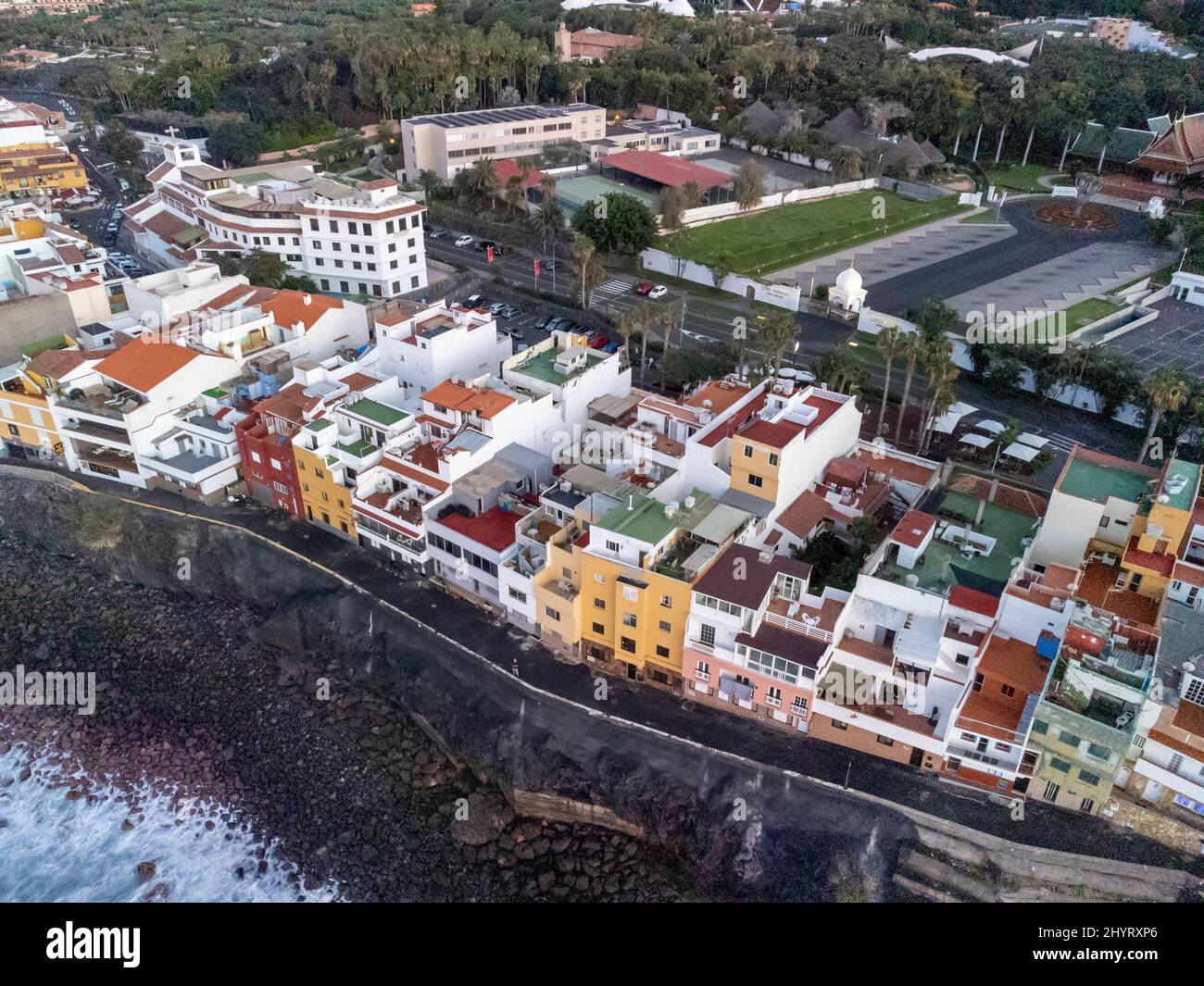 Aerial view on colorful houses and black lava rocks in small fisherman ...