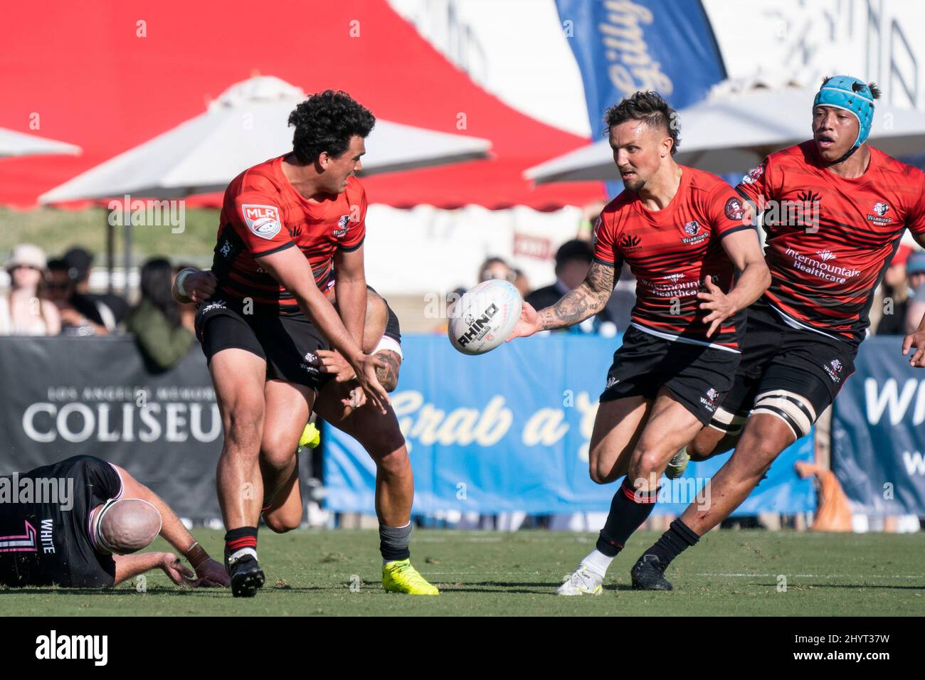 Utah Warriors center Tomasi Tonga (12) tosses to flanker Bailey Wilson (7) during a MLR match ...