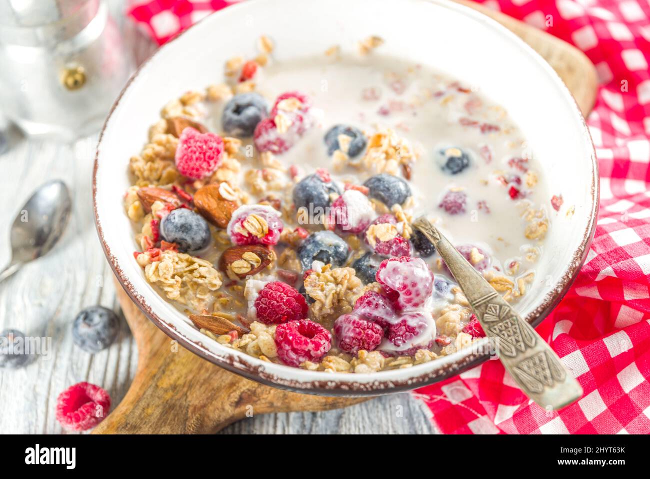 Eating healthy breakfast. Close-up video of eating on granola corn ...