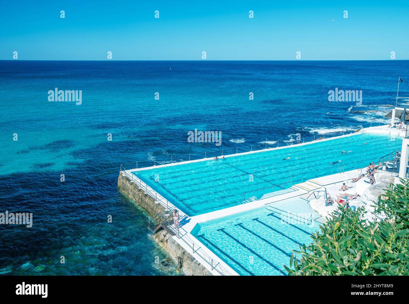 Swimmers enjoy beautiful pool along the sea Stock Photo - Alamy