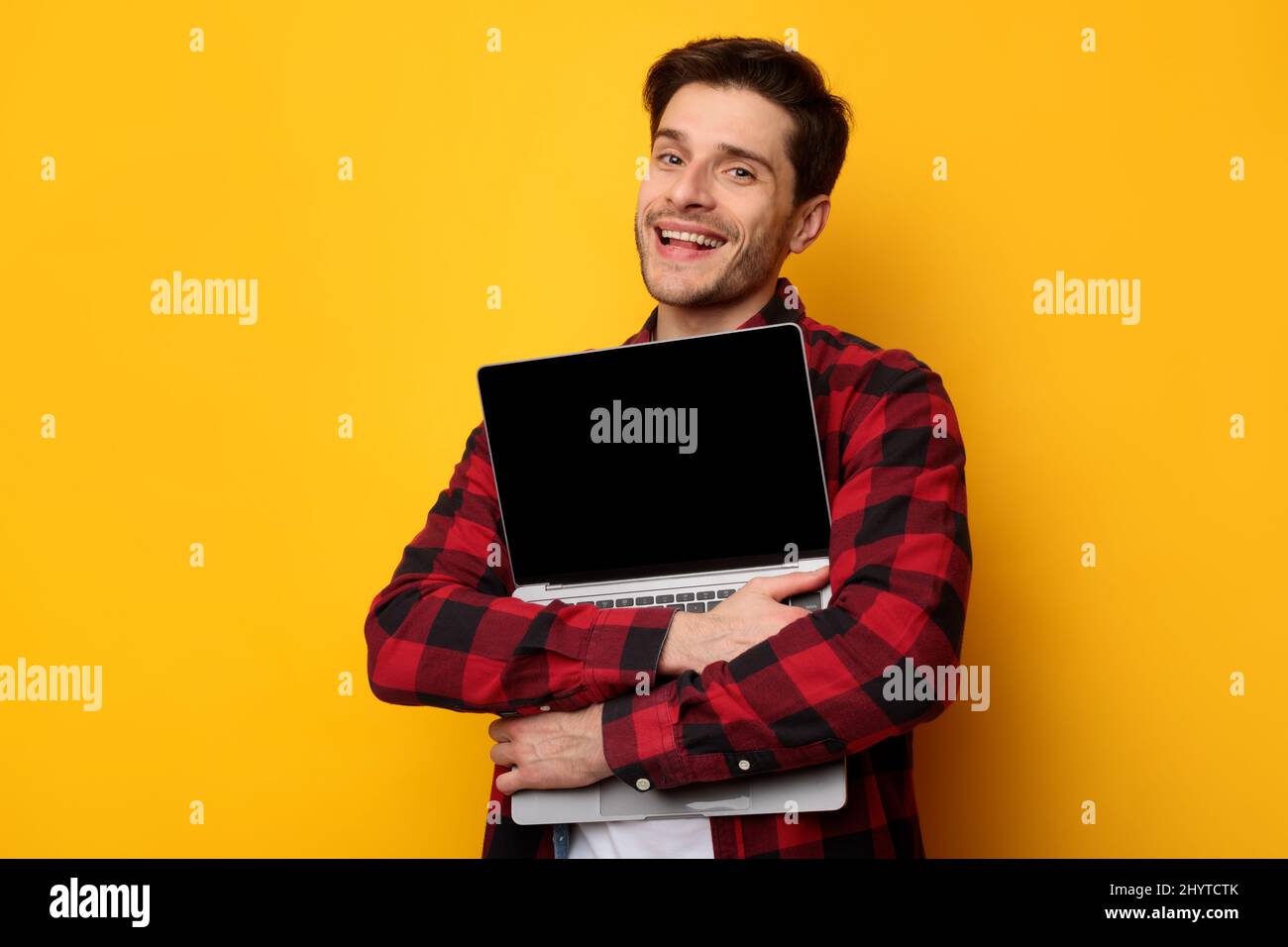 Hugging laptop hi-res stock photography and images - Alamy