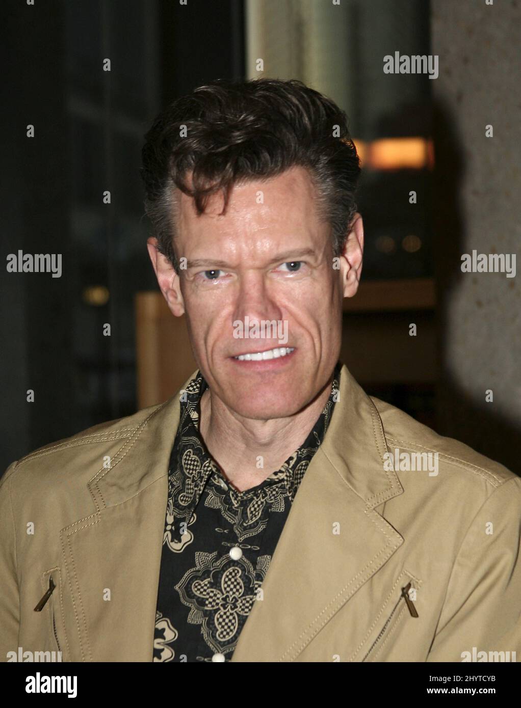 Randy Travis signs copies of his CD "Around the Bend" at the Country ...