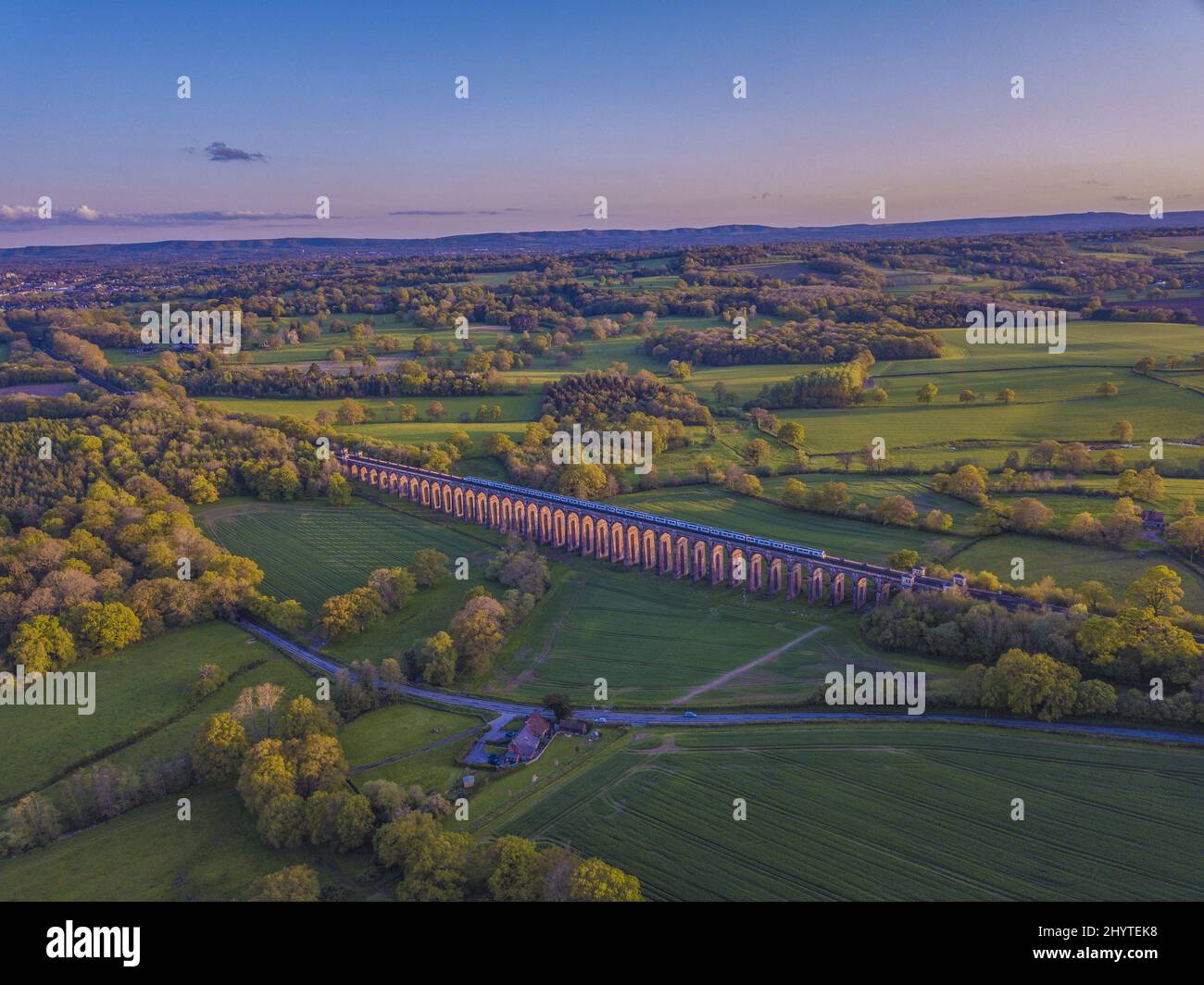 Aerial view of beautiful green fields with the sky in the background ...