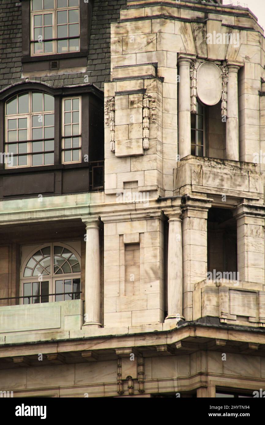 Vertical shot of a dirty old stone building exterior in London, UK ...