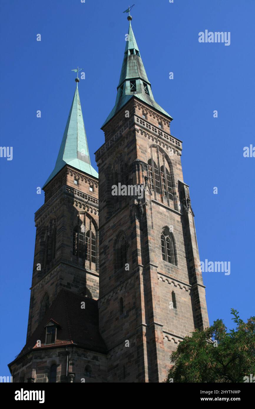 Angle shot of high towers with blue roofs on blue sky in Nuremberg ...