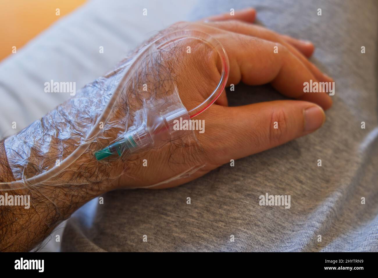 Patient hooked up to iv hi-res stock photography and images - Alamy