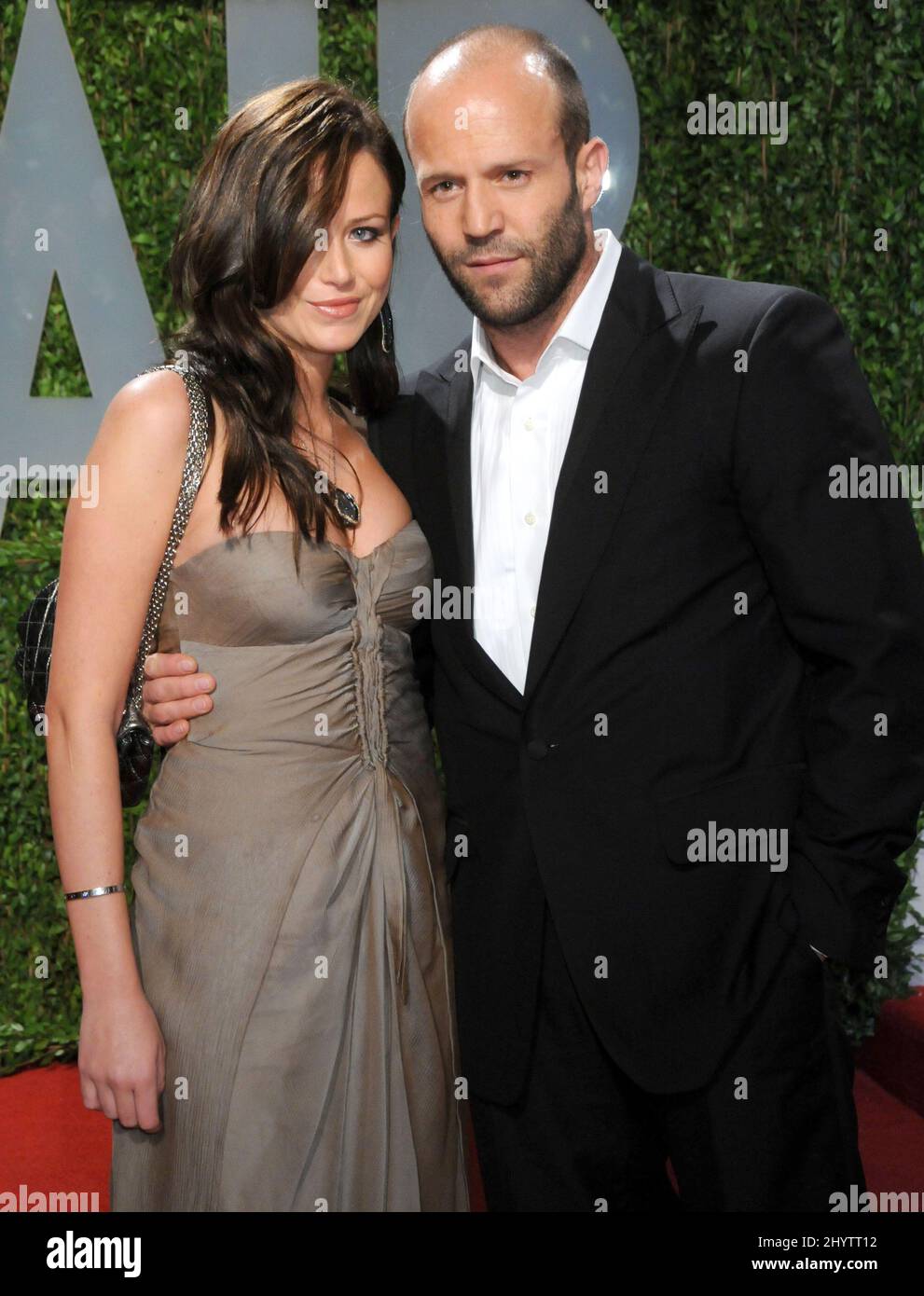 Jason Statham and guest attending the Vanity Fair Oscar Party 2009 held ...