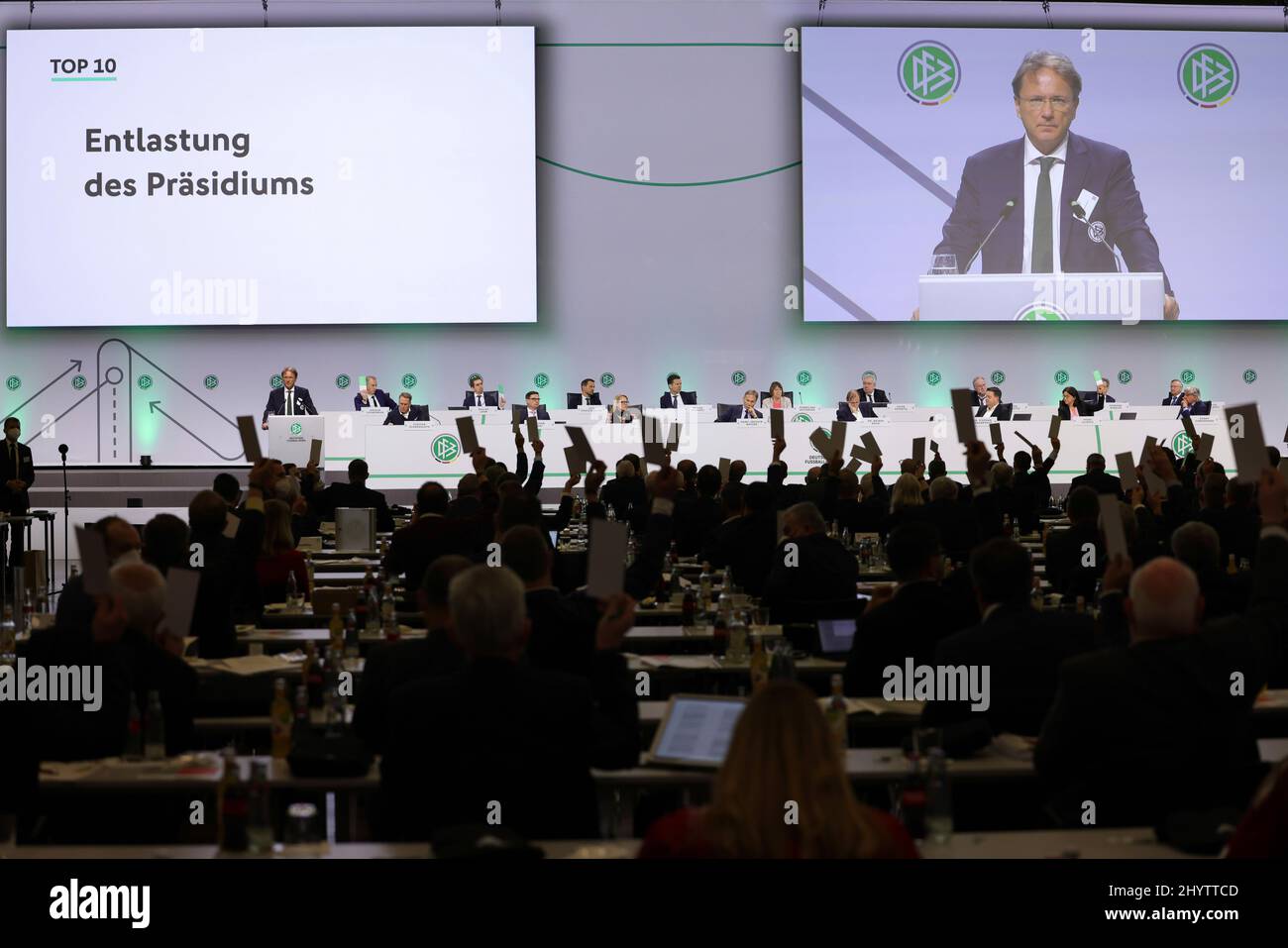 The delegates vote with voting cards for the discharge of the Presidium ...