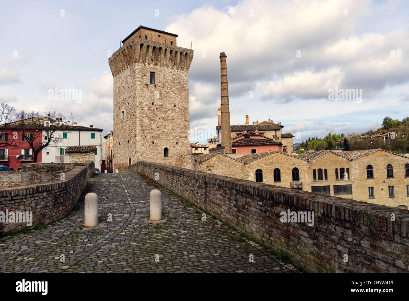 Cityscape of a stoned tower and bridge in Italy Stock Photo - Alamy