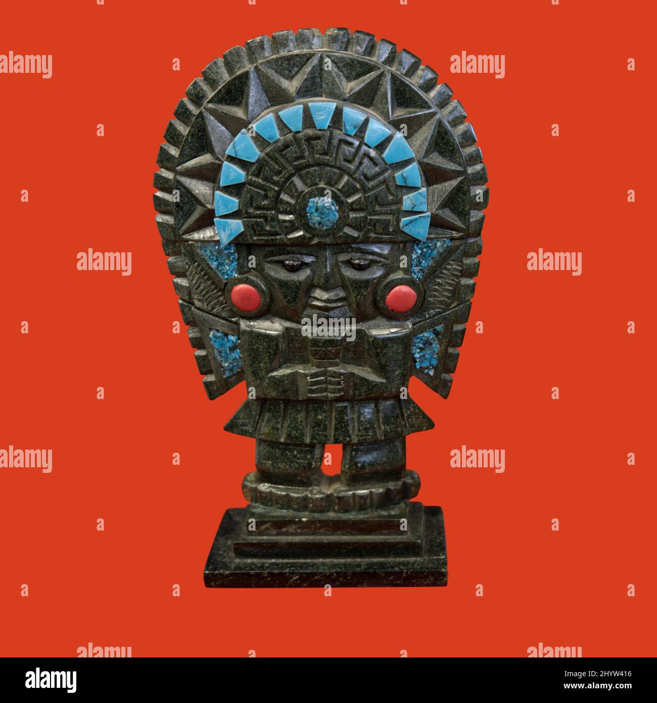 Close-up of a Mayan statue isolated on a red background Stock Photo - Alamy