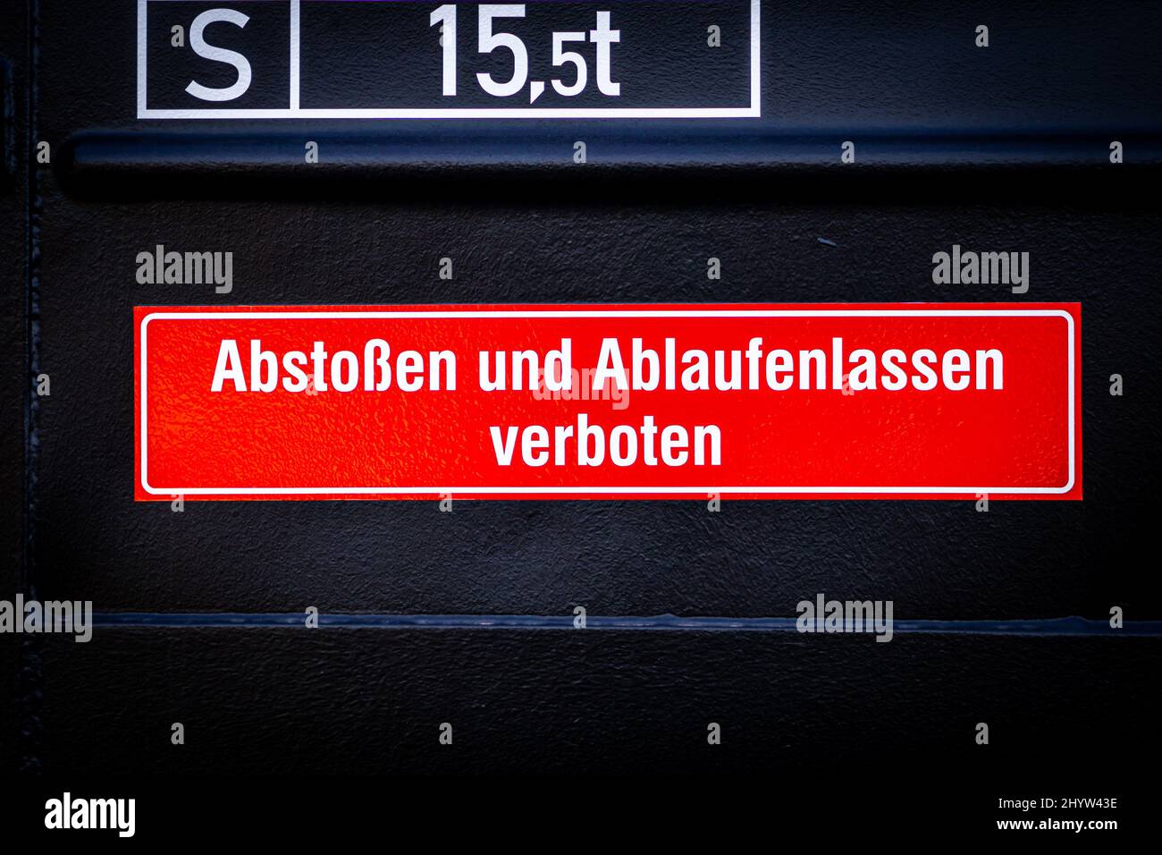 Red sign in German saying that repelling and running off is prohibited ...